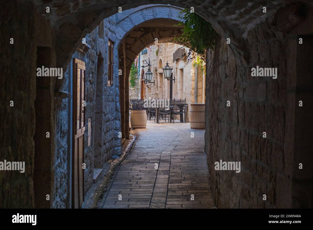 Romantic old narrow cobbled streets and passages in the old town of Rab ...