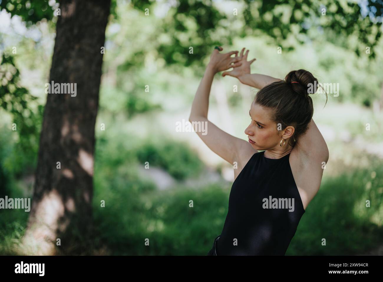 Lovely girl dancing in nature, female dancer performing modern dance outdoors Stock Photo - Alamy