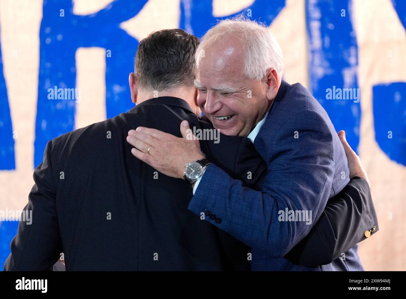 Democratic vice presidential nominee Minnesota Gov. Tim Walz, right ...