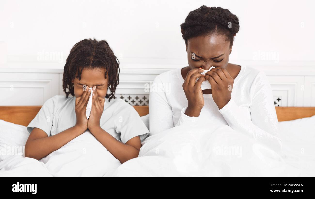 Black girls with allergy symptoms blowing nose Stock Photo - Alamy