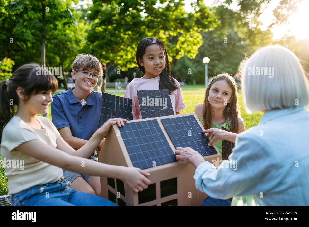 Children learning about renewable energy and solar panels during ...