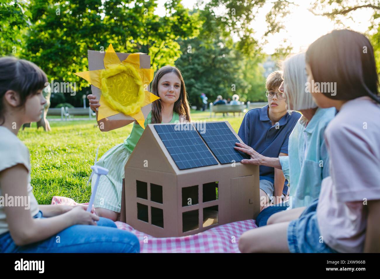 Children learning about renewable energy and solar panels during ...
