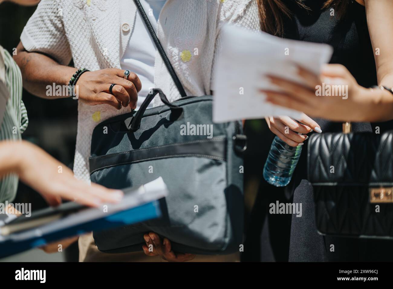 Mixed race business partners analyzing financial documents and ...