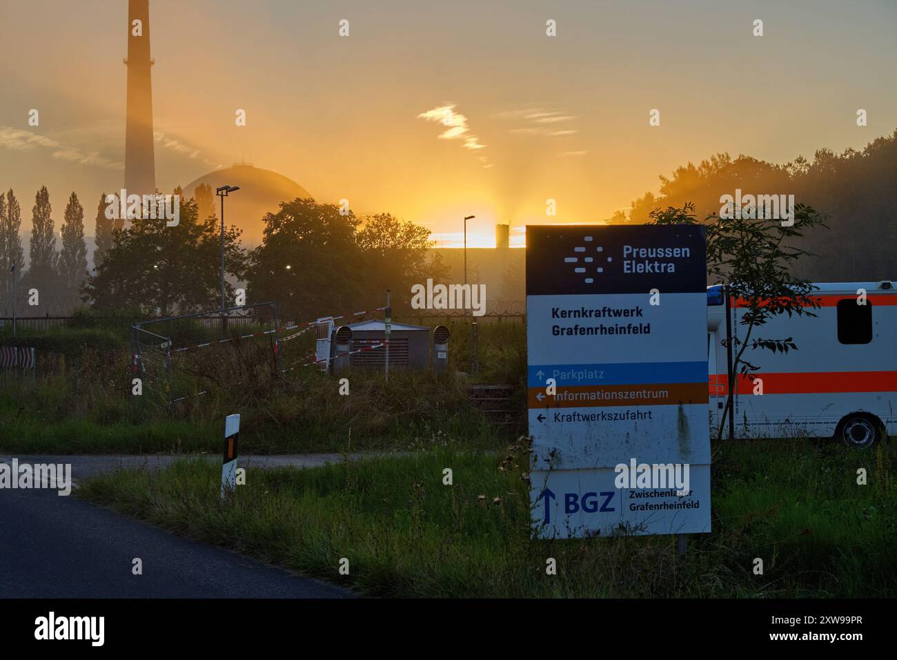 Pipe and nuclear reactor dome with name plate and ambulance car in ...