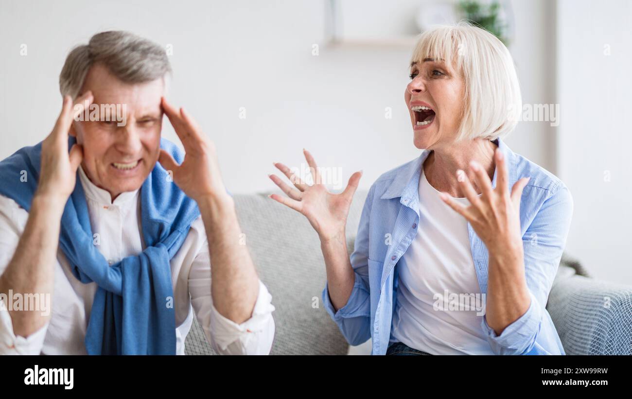 Aggressive mature couple having misunderstood, quarreling at home Stock ...