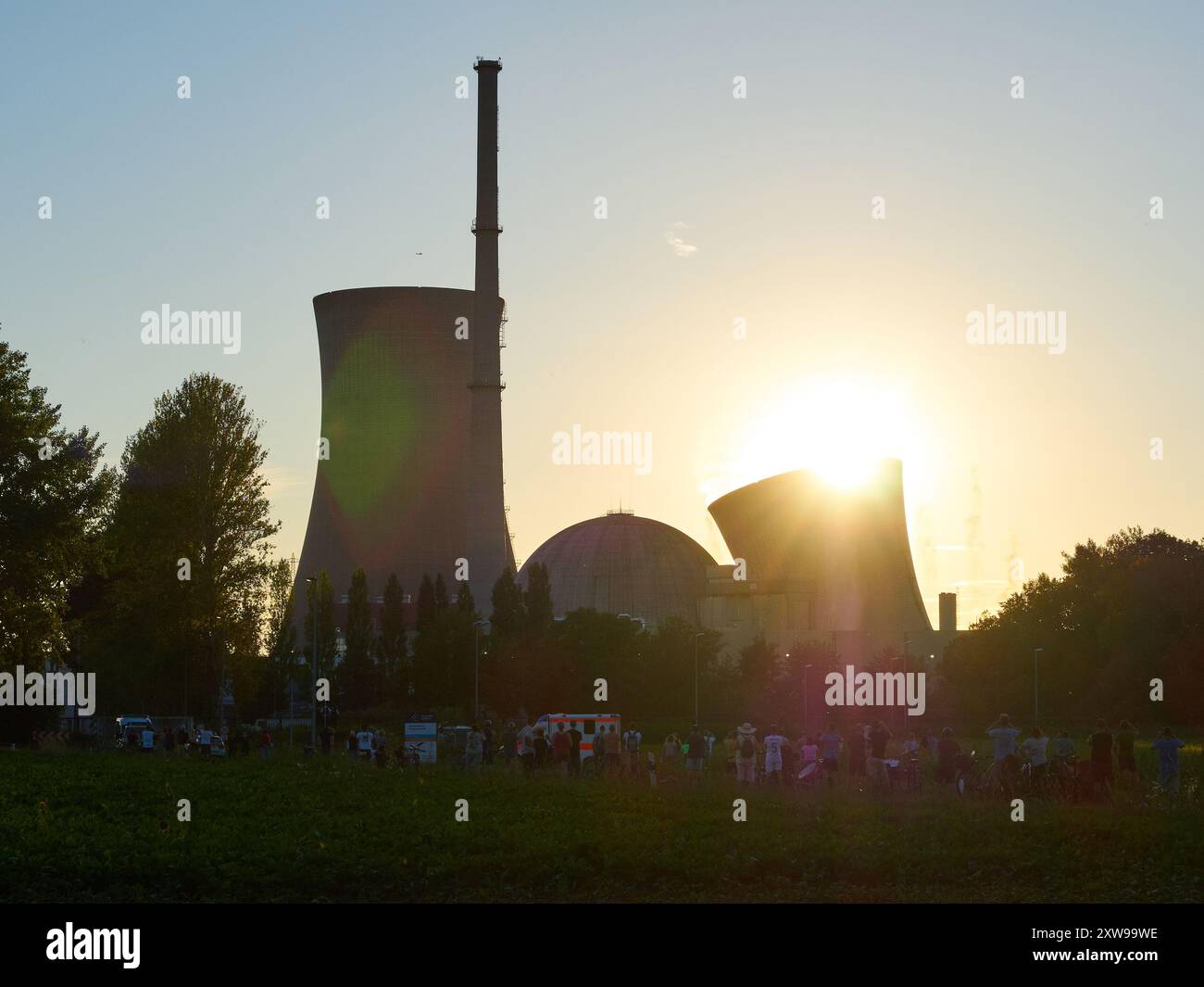 People looking on nuclear power plant cooling tower demolition at ...
