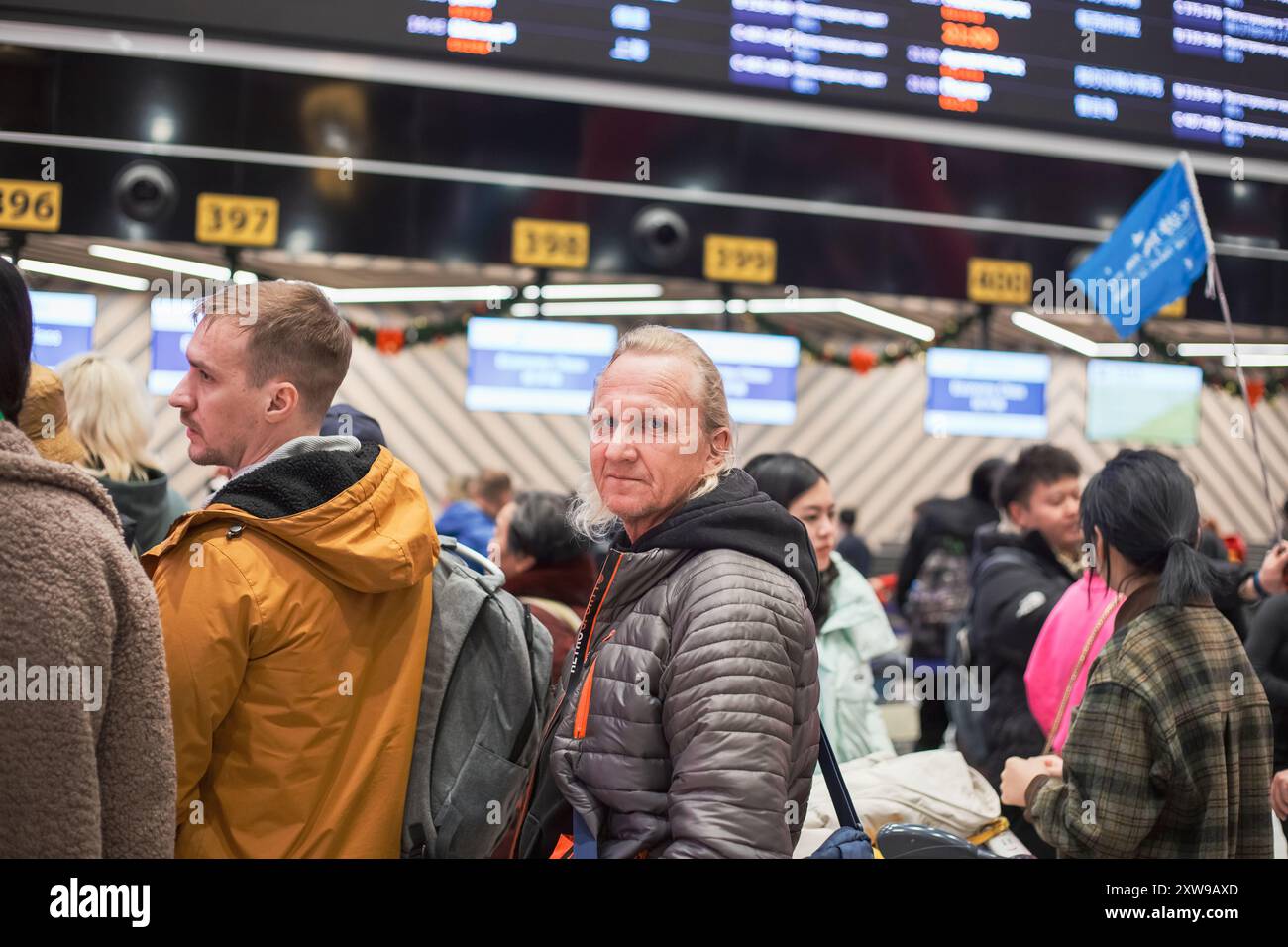 Passengers of the plane at Sheremetyevo airport, check-in counter with ...