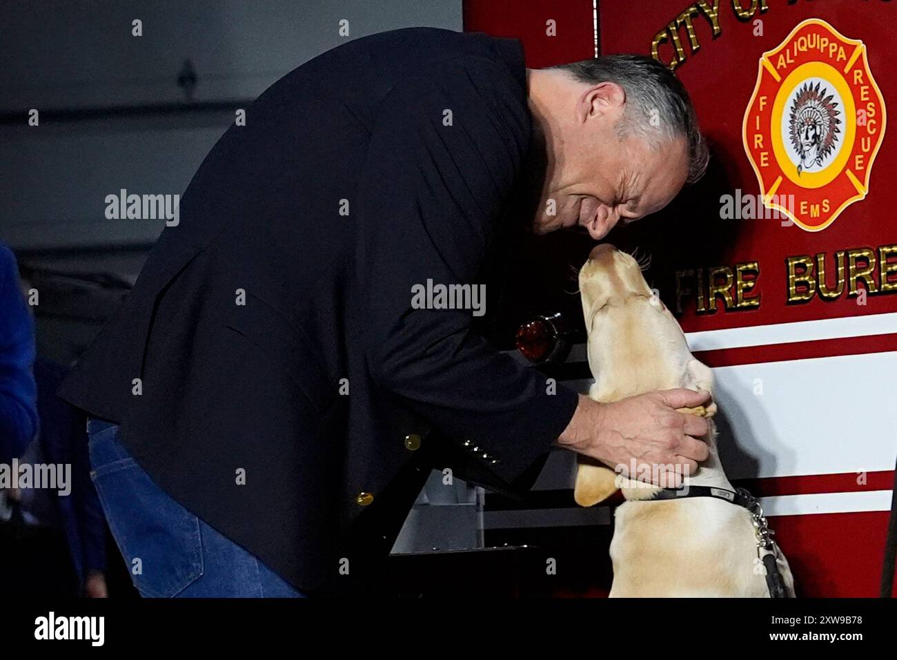 Second gentleman Doug Emhoff greets a dog and members of the Aliquippa ...