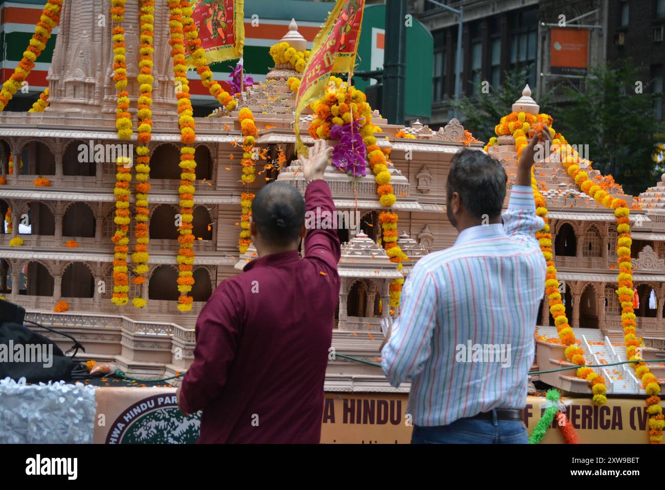 Men throwing marigold petals at the Ram Mandir float in the annual ...