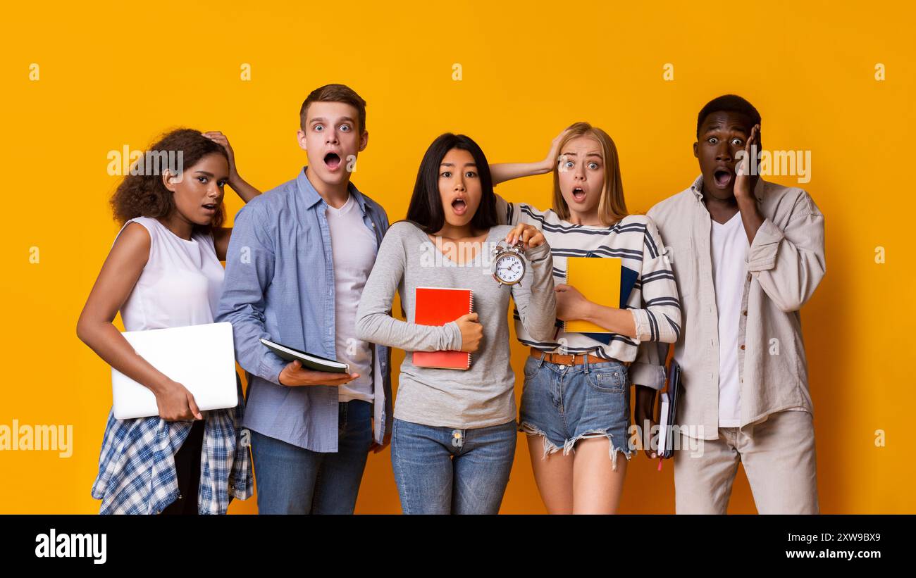 Stressed group of international students with alarm over yellow ...