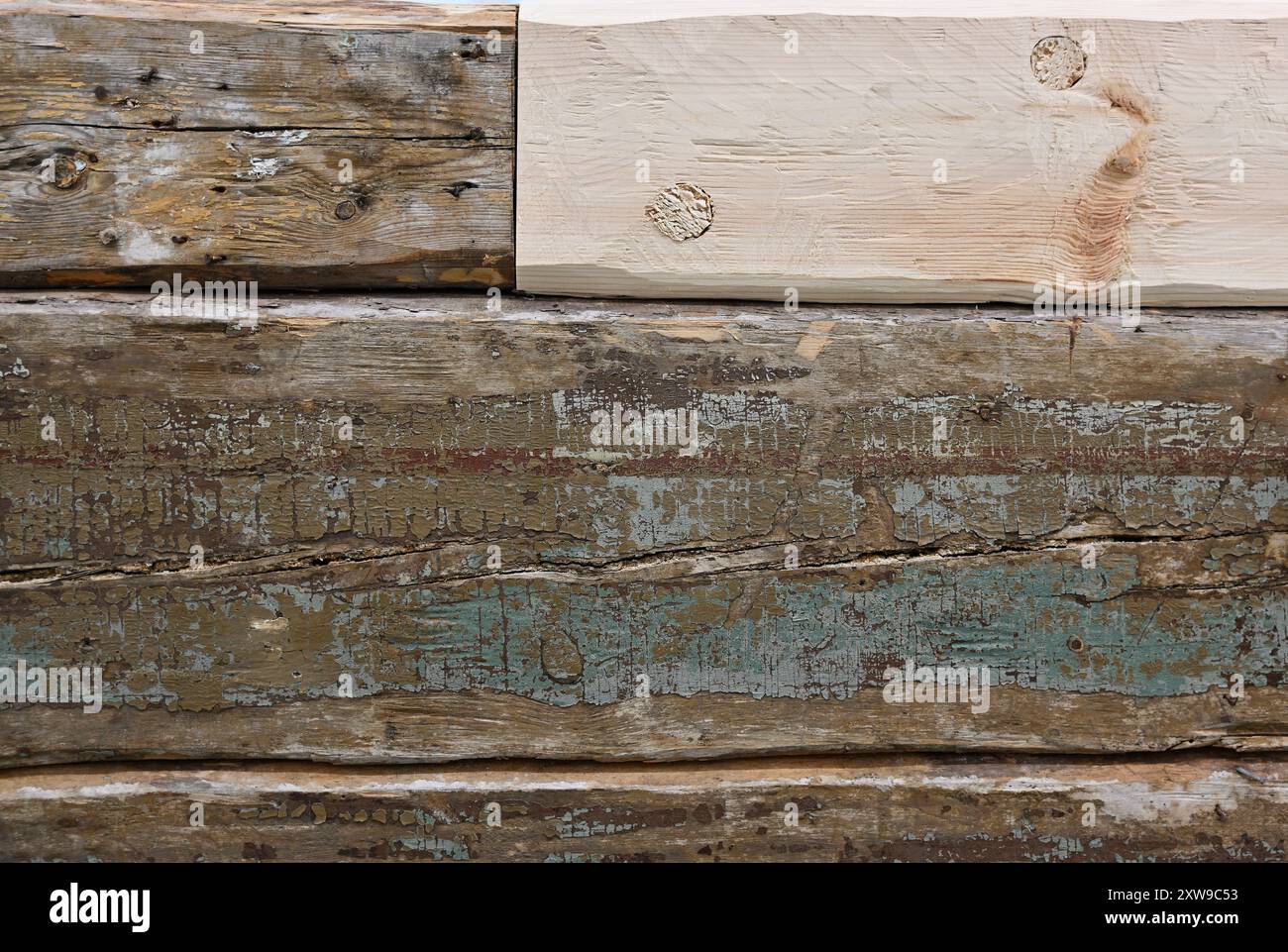 The image presents a close-up view of aged and weathered wooden planks ...