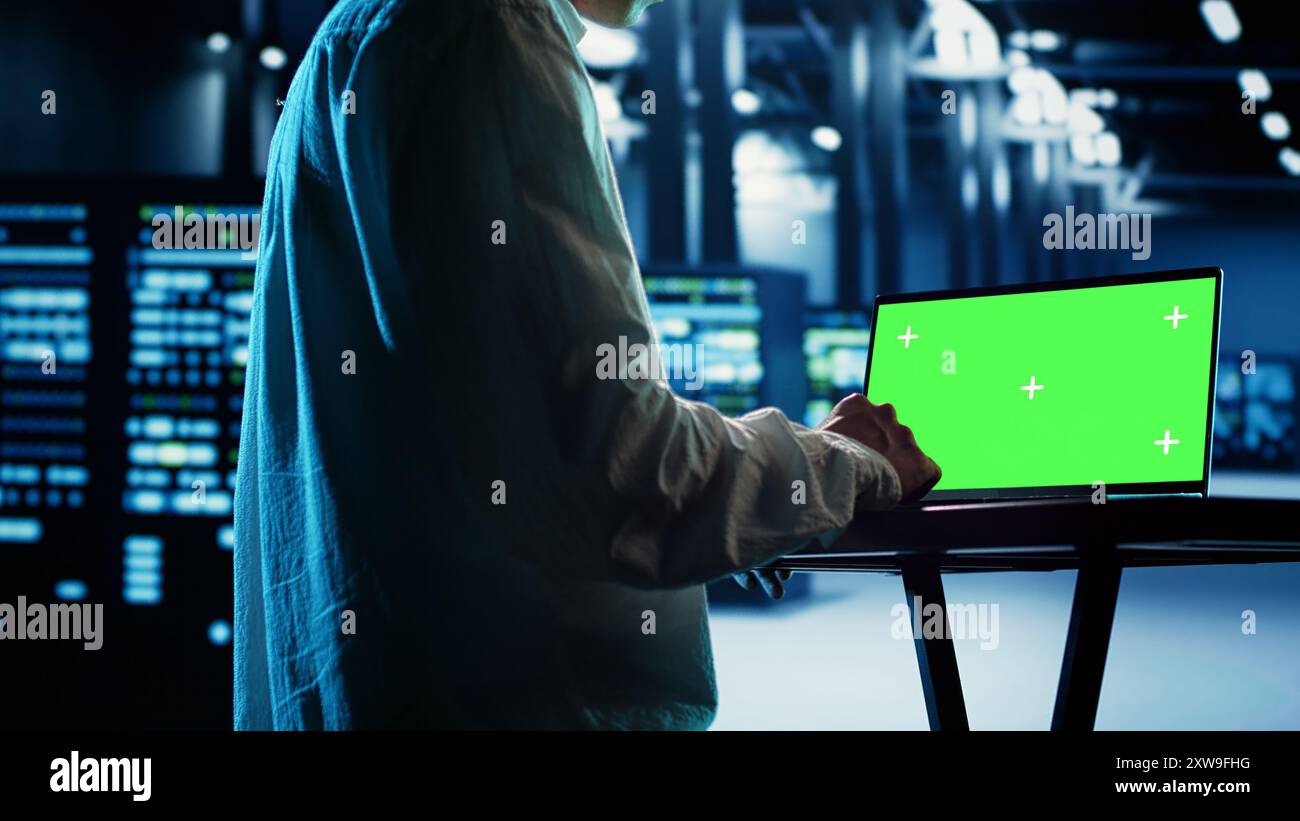 Asian employee using isolated screen laptop to implement artificial intelligence parallel ...