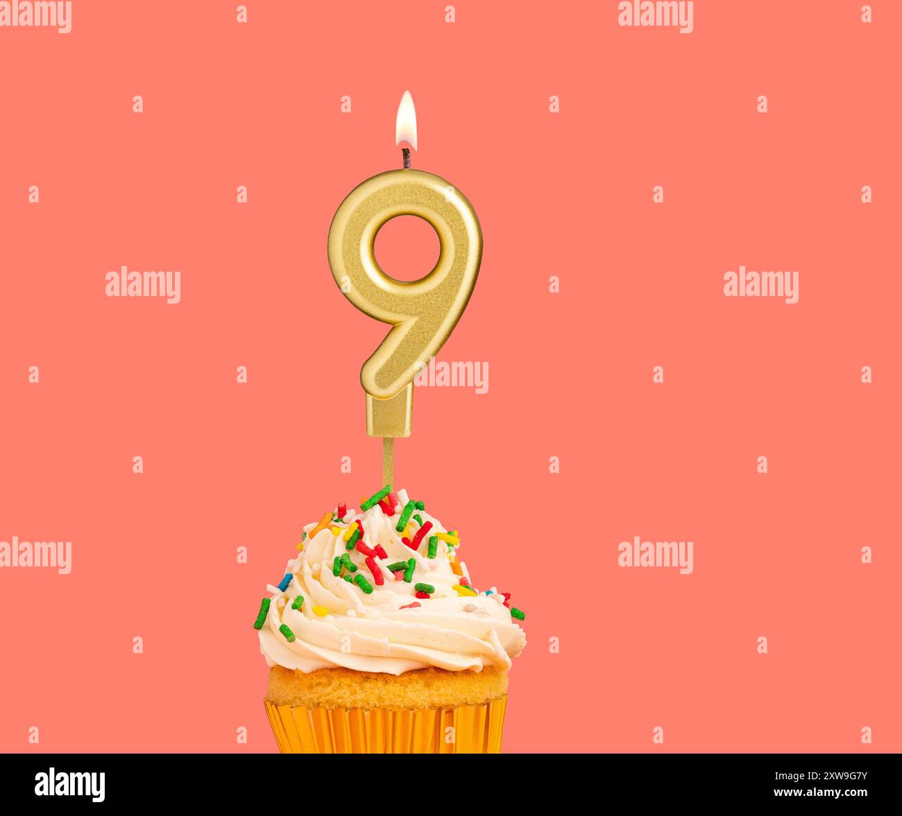 Birthday number 9 - Golden candle with cupcake Stock Photo - Alamy