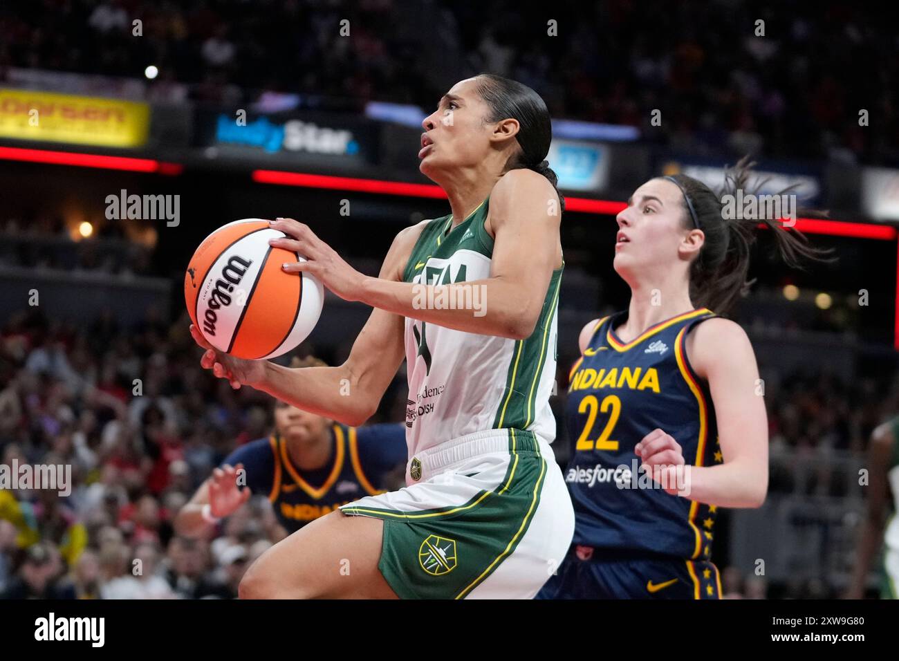 Seattle Storm's Skylar Diggins-Smith, left, goes up the basket against ...