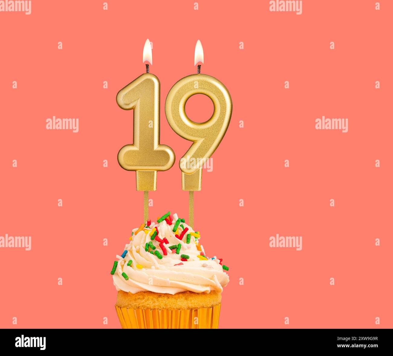 Birthday number 19 - Golden candle with cupcake Stock Photo - Alamy
