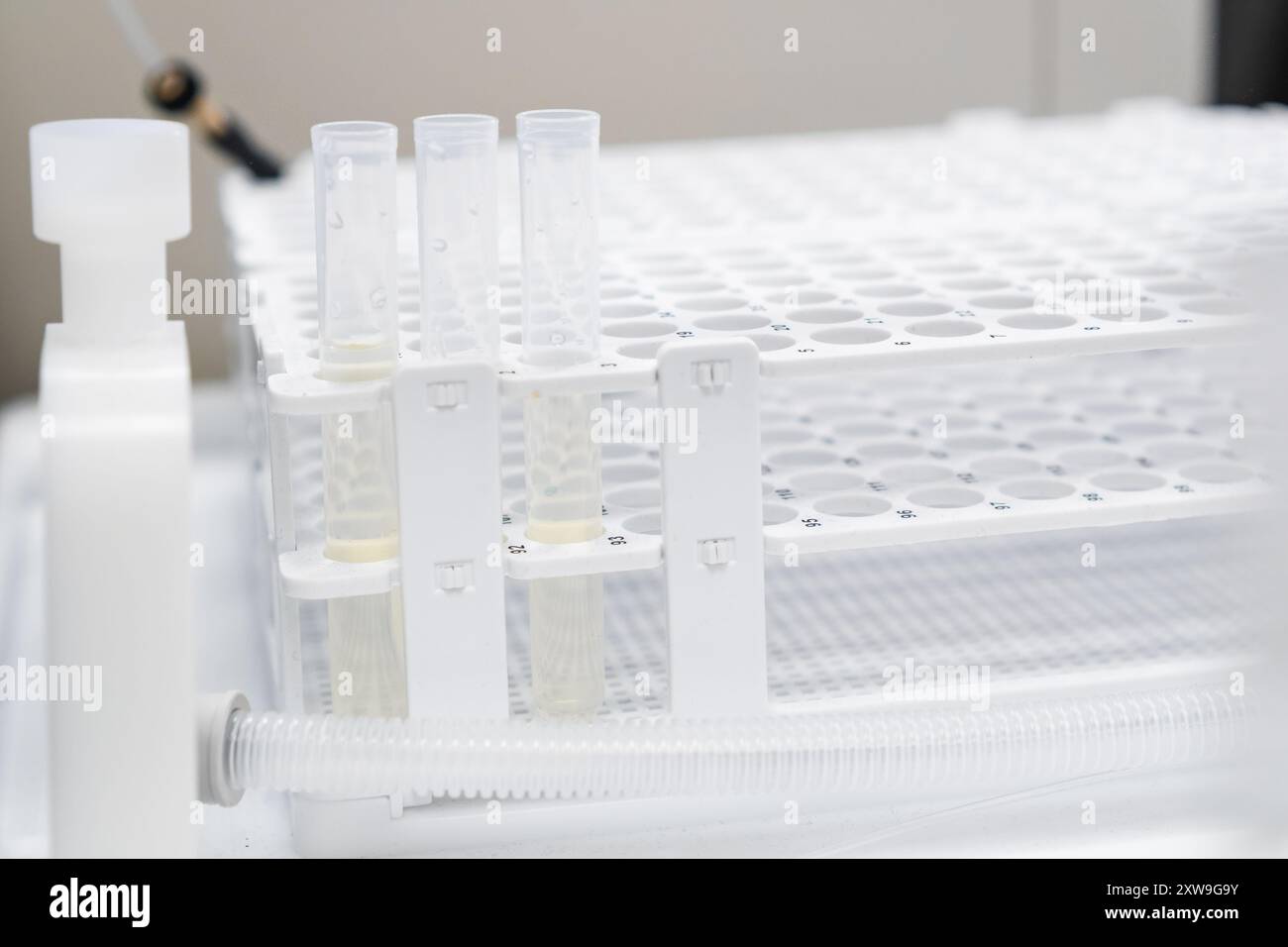 Fraction collector with tubes connected to HPLC Stock Photo - Alamy