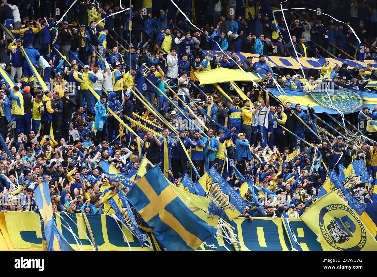 Boca Juniors’ supporers cheer for their team during the Argentine ...