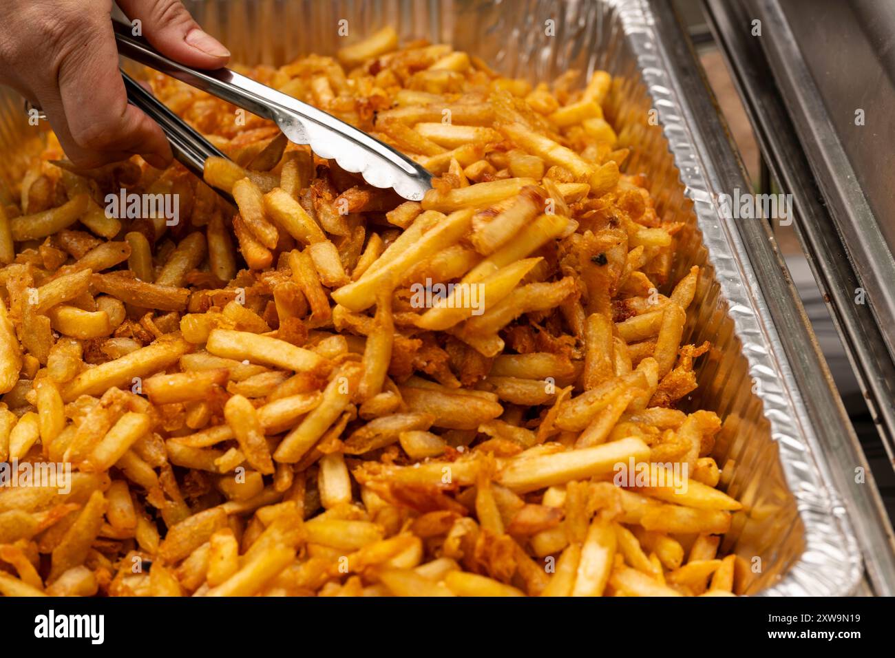 Grabbing chips hi-res stock photography and images - Alamy