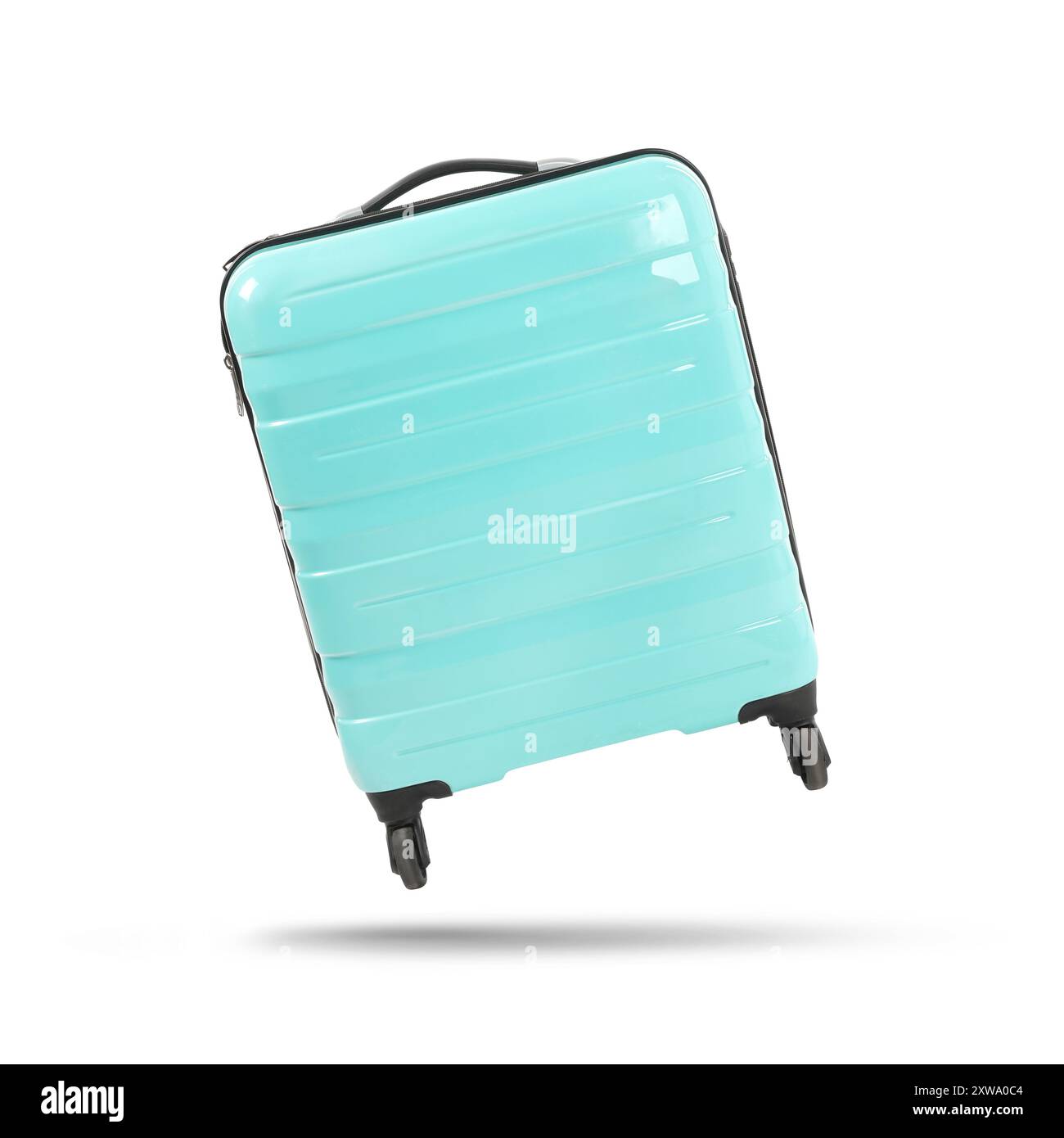 Turquoise suitcase in air on white background Stock Photo - Alamy