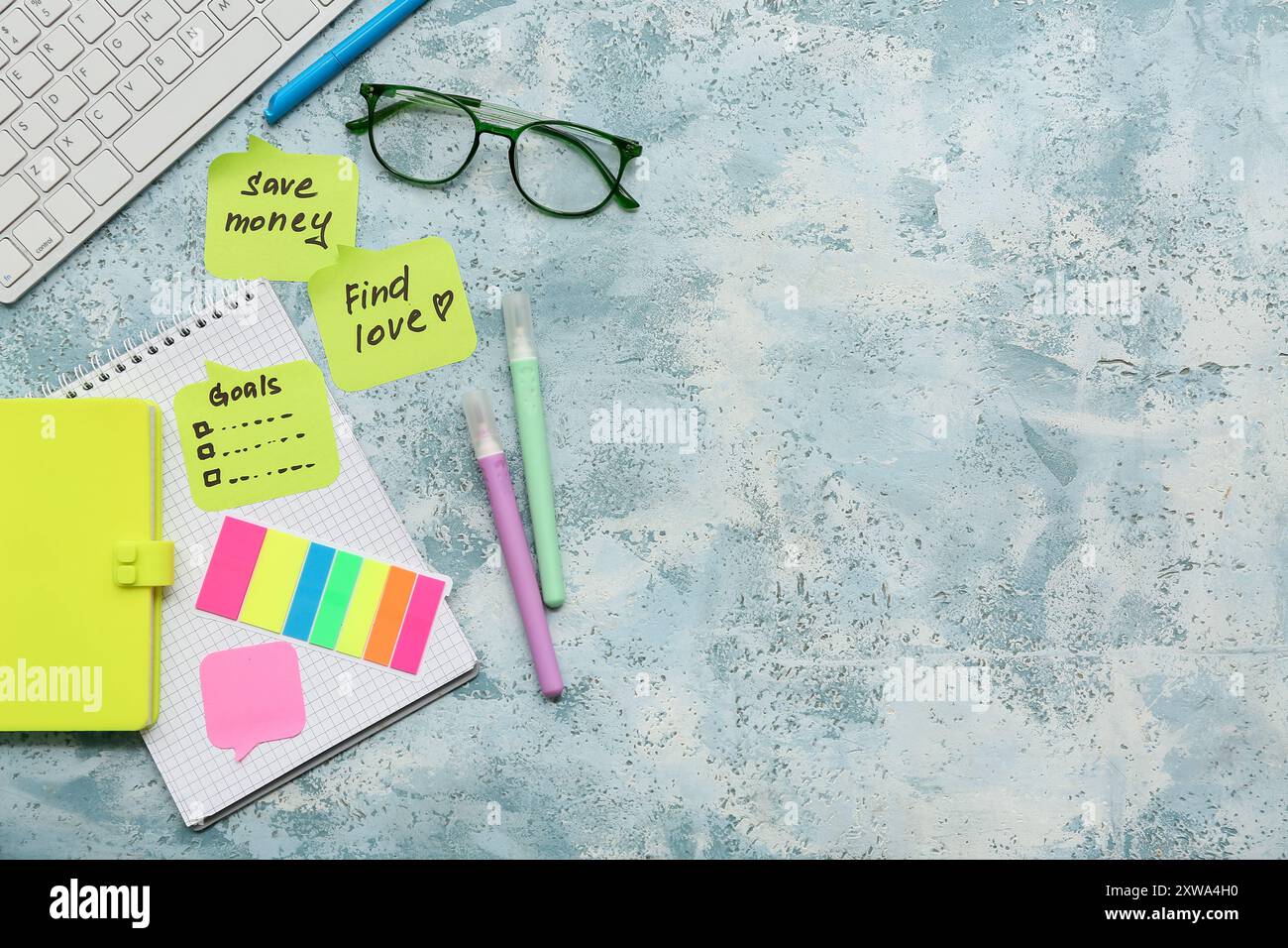 Sticky notes with to do plans, computer keyboard and notebook on blue ...