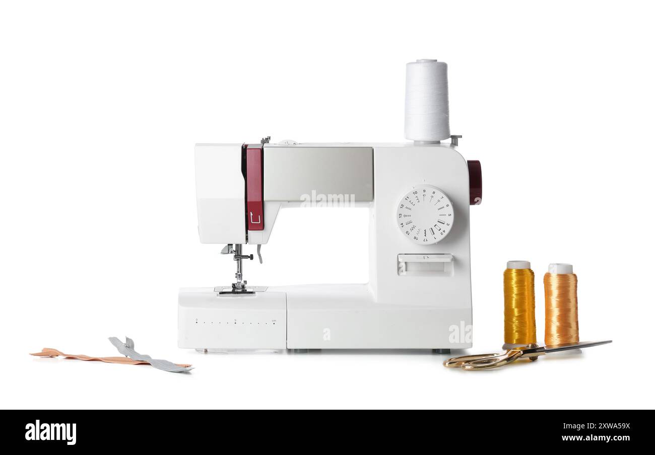 Modern sewing machine with tailor's supplies isolated on white ...