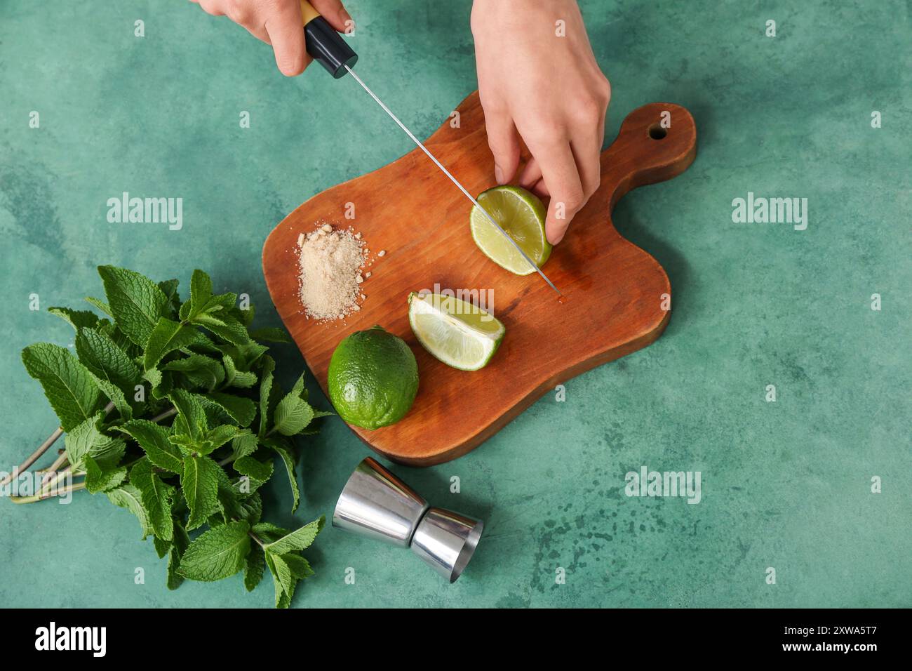 Young woman cutting lime top hi-res stock photography and images - Alamy