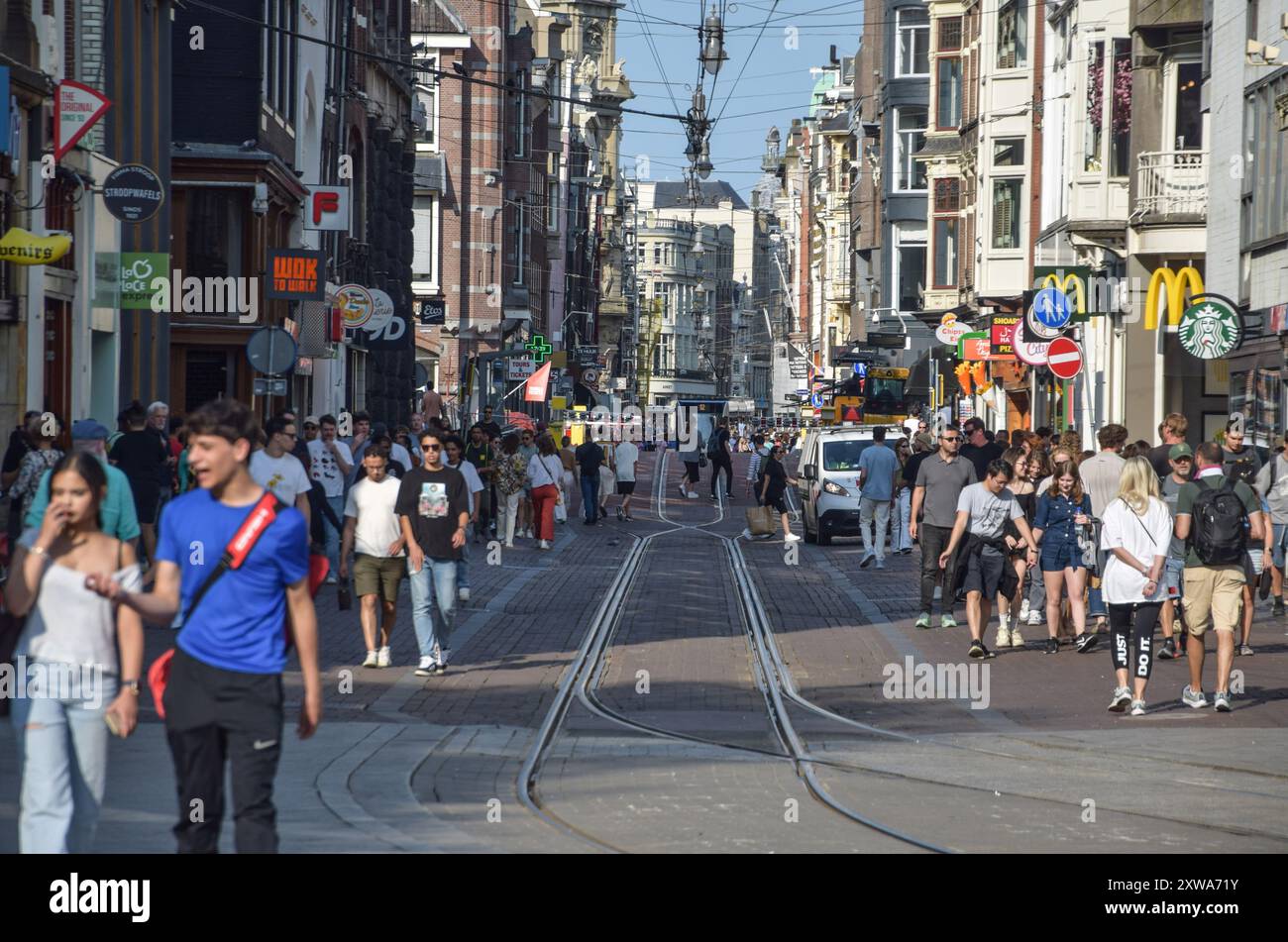 People stroll in the center of Amsterdam city, Netherlands, on August ...