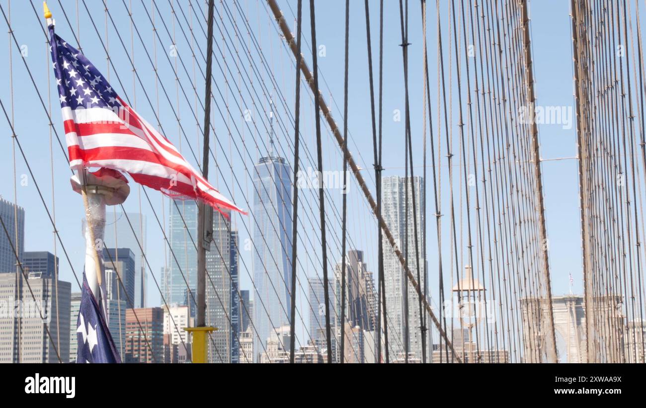 Flag on Brooklyn Bridge, Manhattan downtown, New York City skyline ...