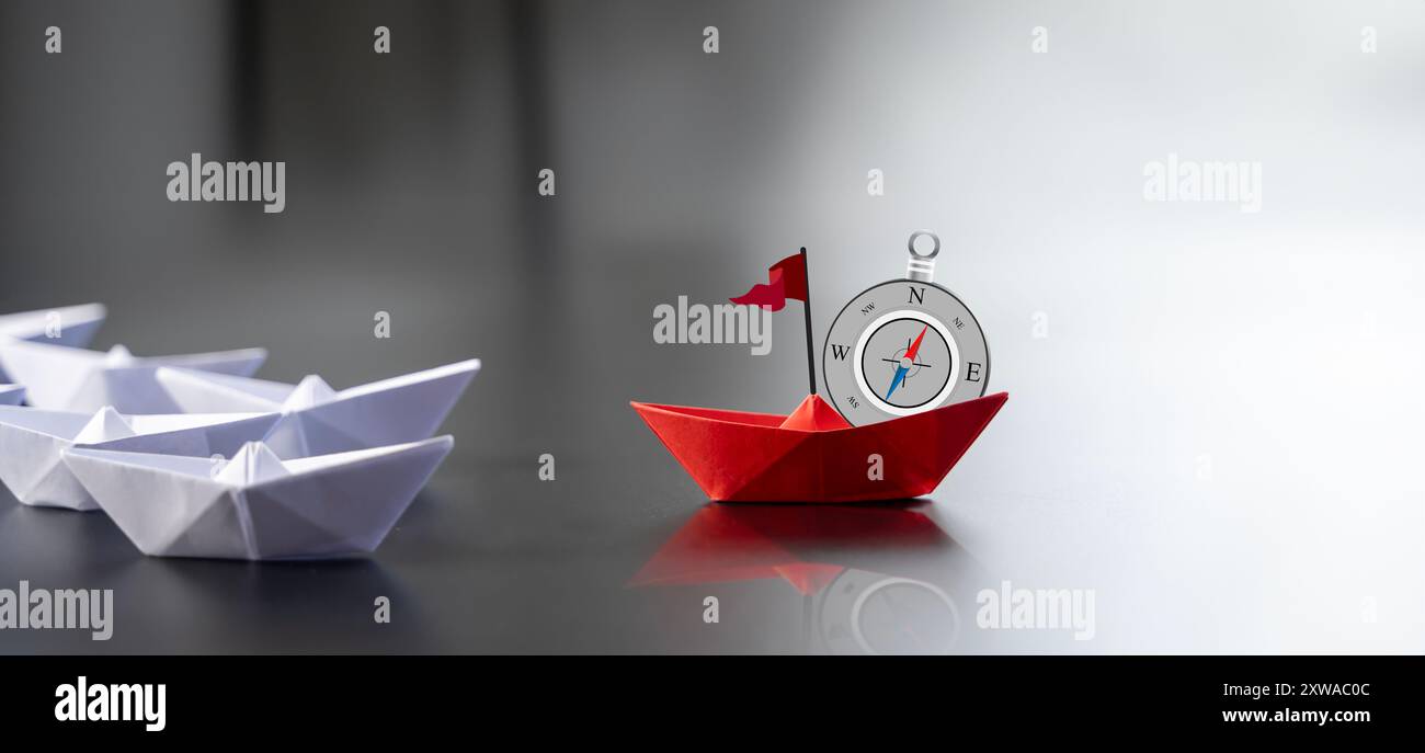 Red Paper Boat On Compass Leading A Fleet Of Small White Boats ...