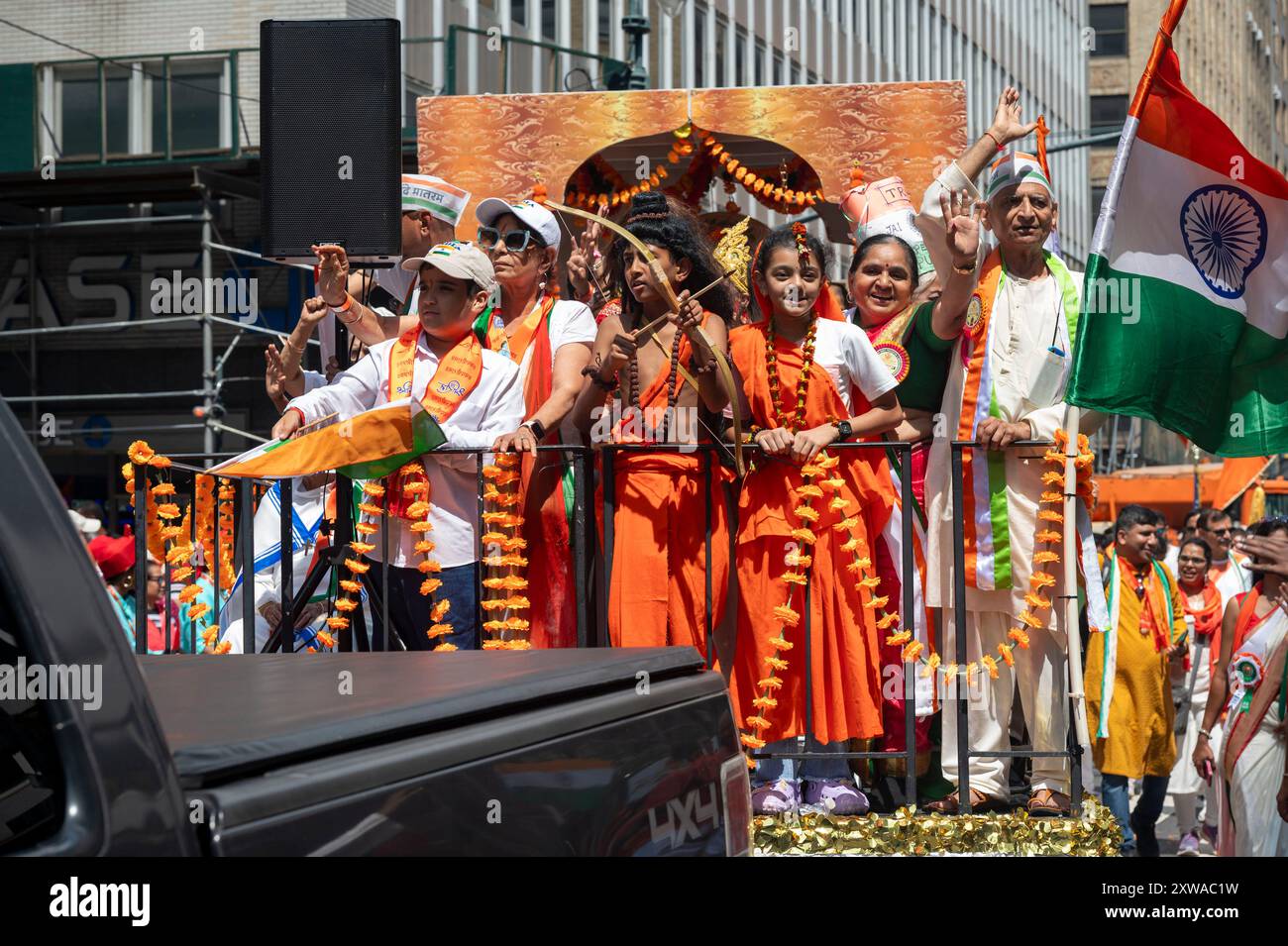 New York, United States. 18th Aug, 2024. Participants ride a float at ...