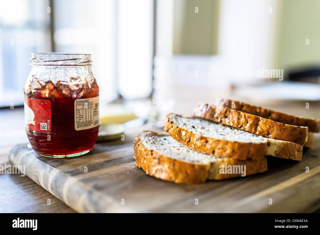 Strawberry jam on bread Stock Photo - Alamy