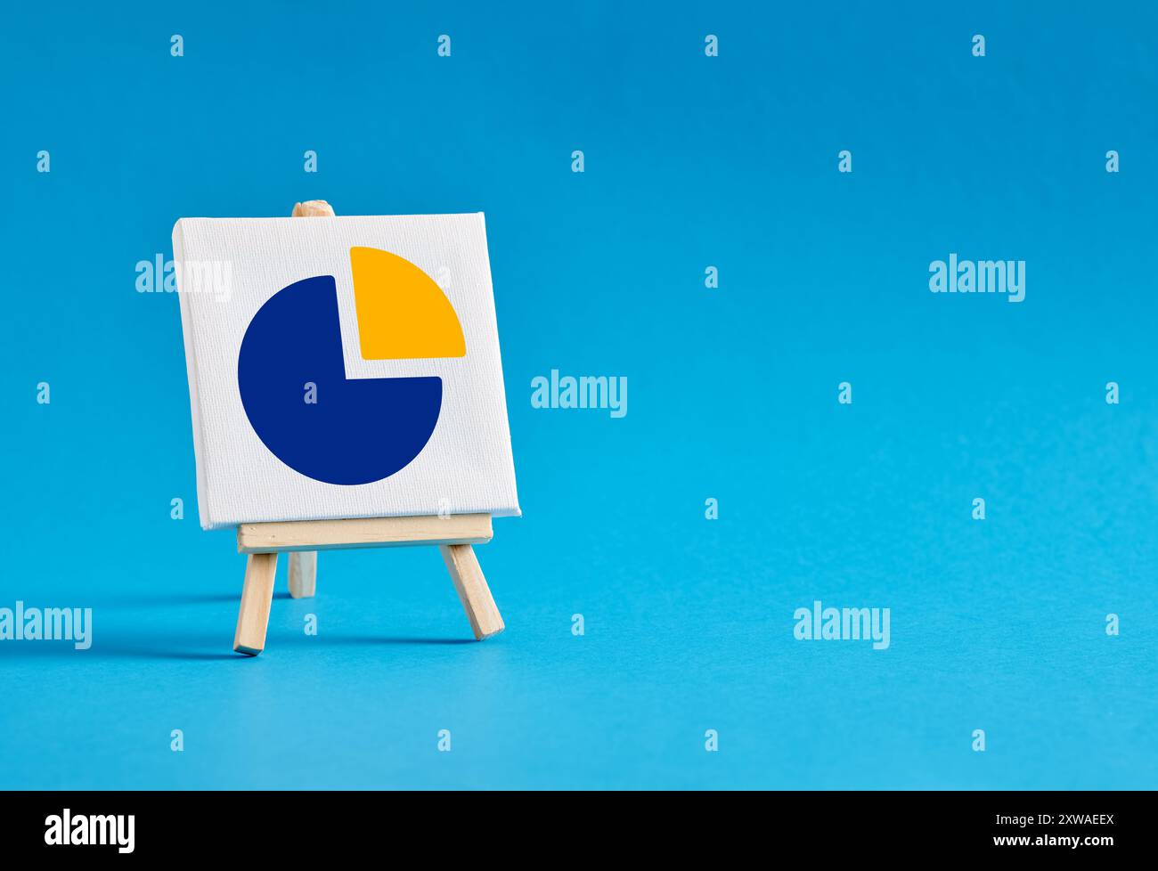 Pie chart or business graph on an easel against blue background ...