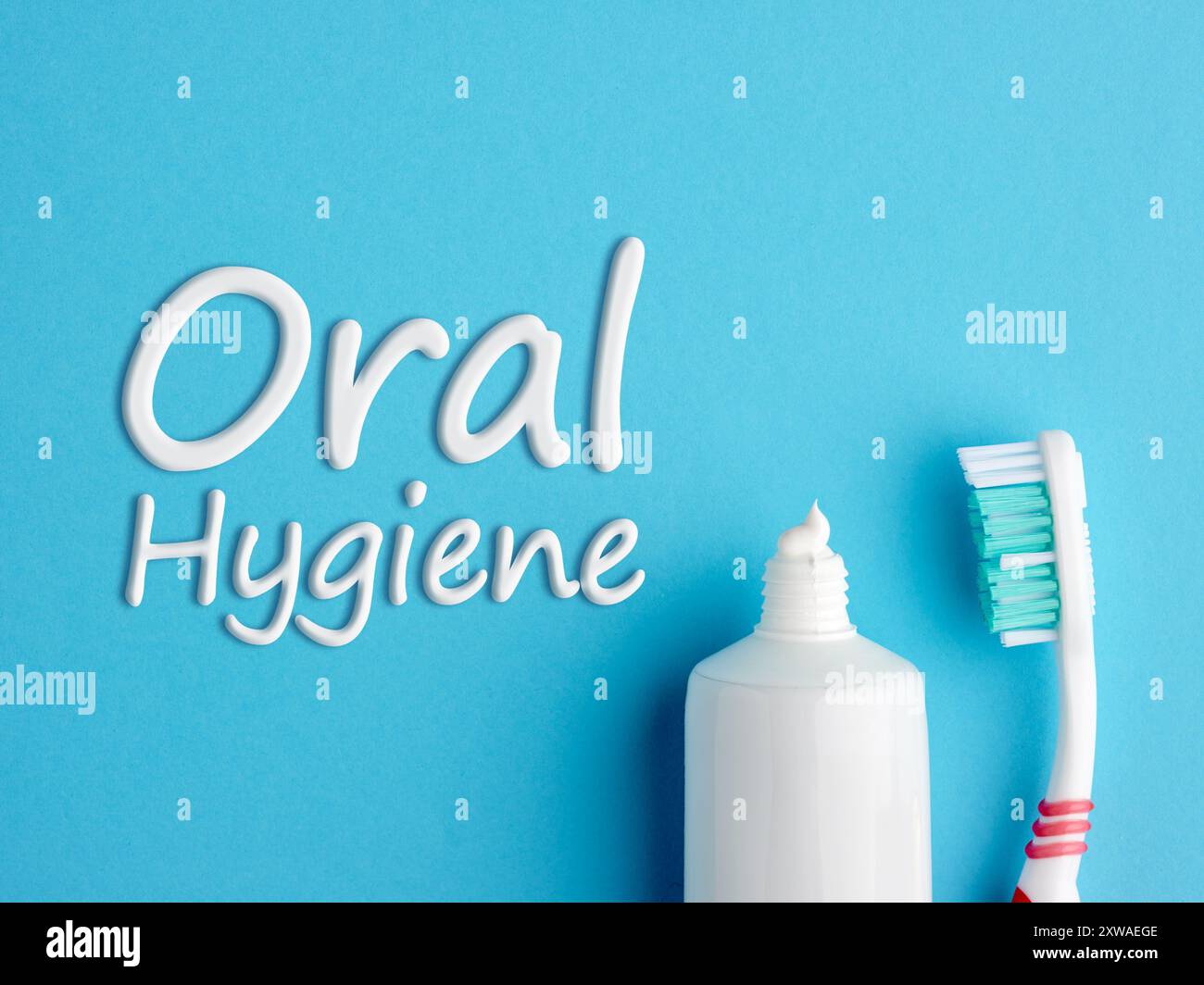 The word Oral Hygiene written with toothpaste on blue background ...