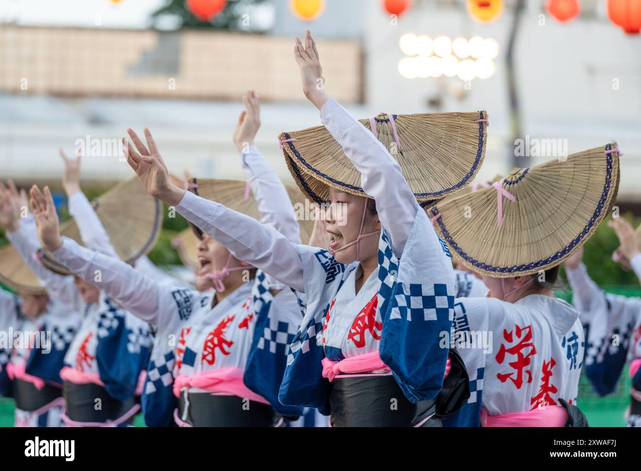 Tokushima Awa Odori Festival 2024. Performers wear traditional obon costumes, dance and sing as ...