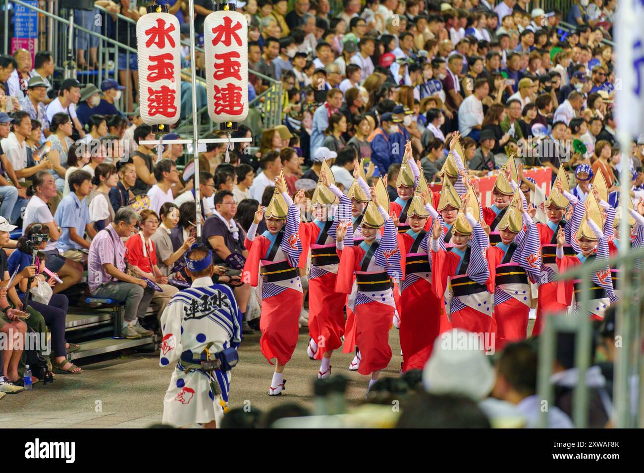 Tokushima Awa Odori Festival 2024. Performers wear traditional costumes, dance and sing in a ...