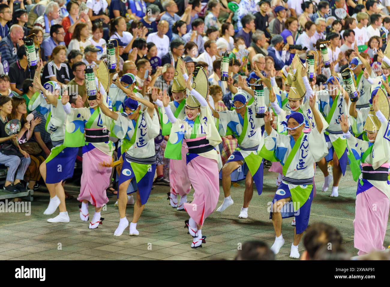 Tokushima Awa Odori Festival 2024. Performers wear traditional costumes, dance and sing in a ...