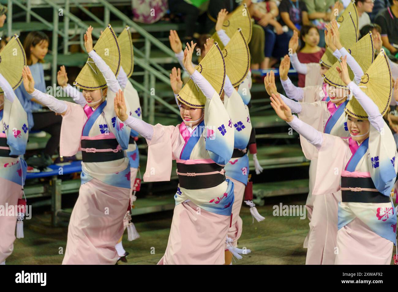 Tokushima Awa Odori Festival 2024. Performers wear traditional costumes, dance and sing in a ...
