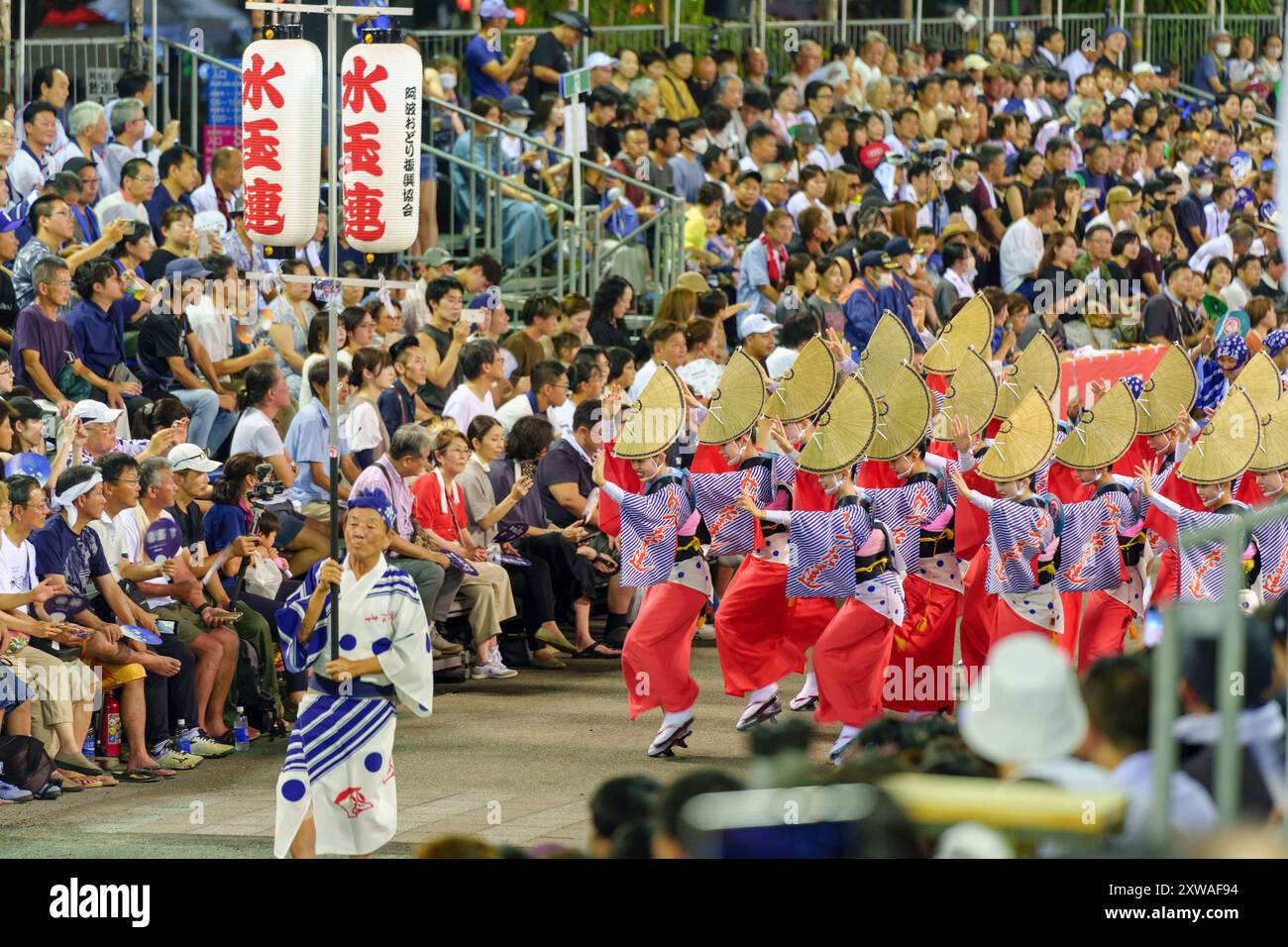Tokushima Awa Odori Festival 2024. Performers wear traditional costumes, dance and sing in a ...