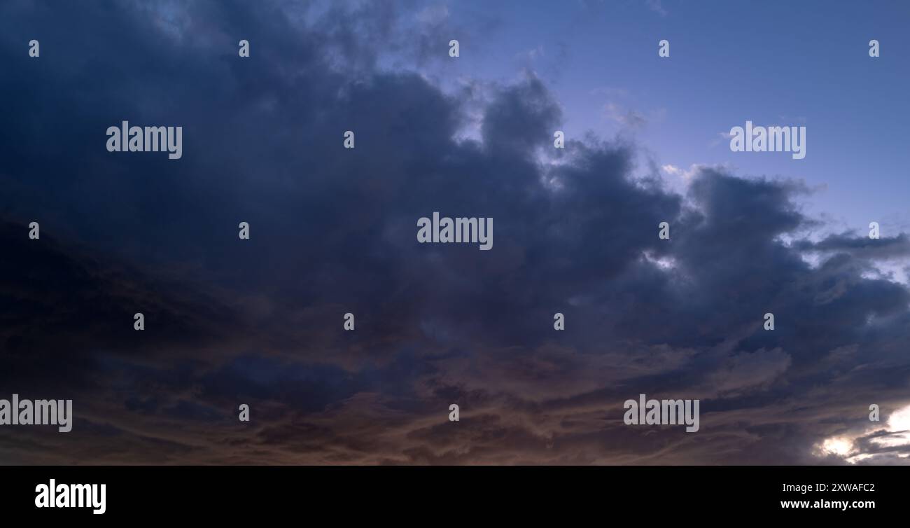 Tropical sunset. Beautiful sunset sky with clouds. Orange sunset, dark clouds in sky. Background ...