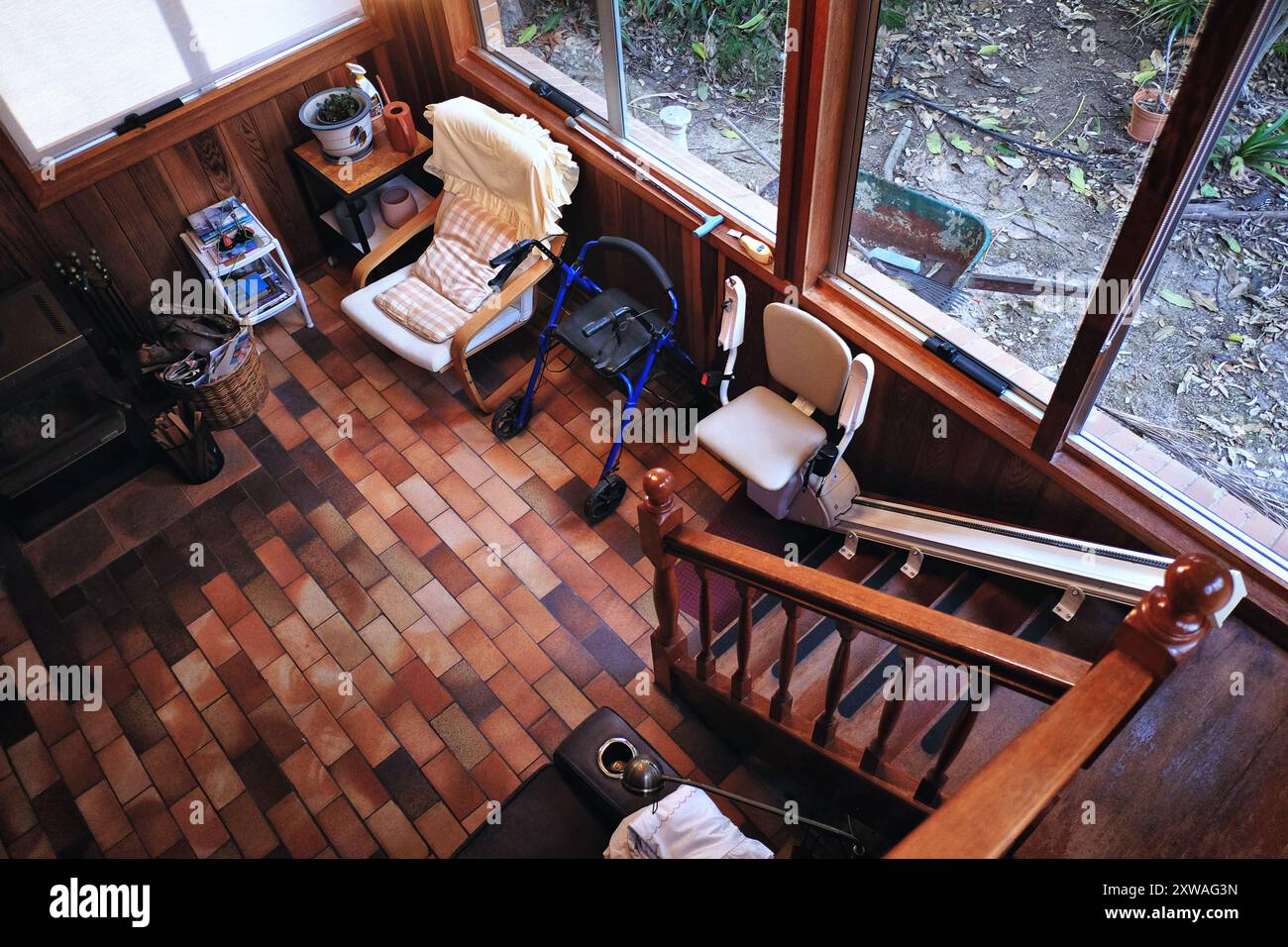 Overhead view of a sunroom with a wheelie walker and stair lift ...