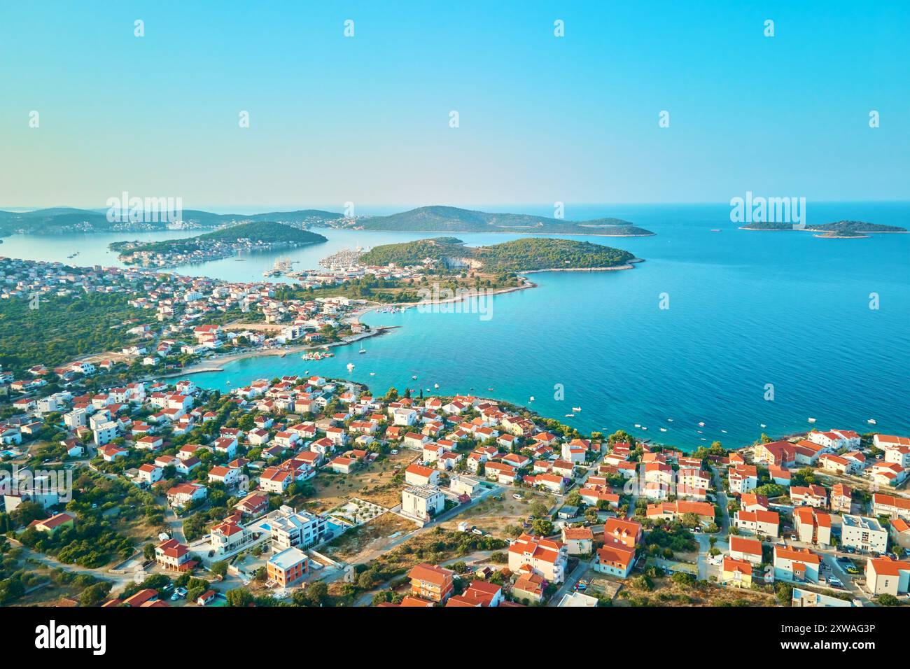Aerial view of coastal town with colorful buildings near sea coastline ...