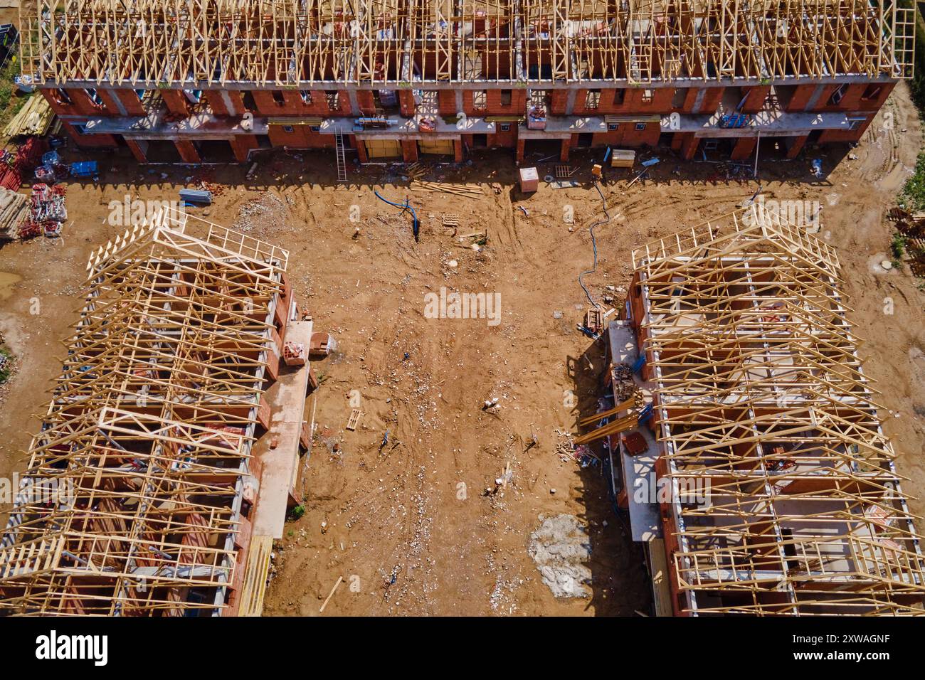 New house under construction, wooden truss system forming roof. Process ...