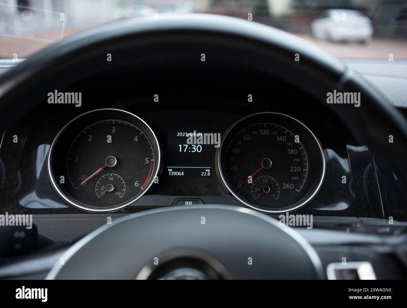 A card dashboard captured from the middle of the front seat of a modern ...