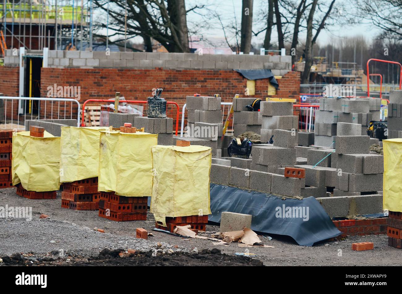 Red bricks and concrete blocks delivered on construction site and ready ...