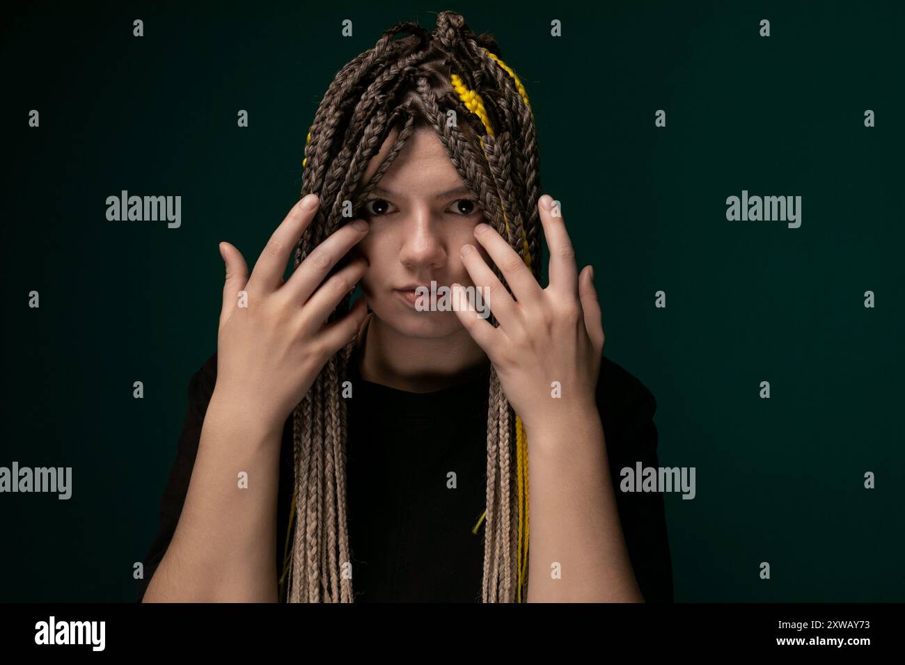 Woman With Dreadlocks Covering Her Face Stock Photo - Alamy