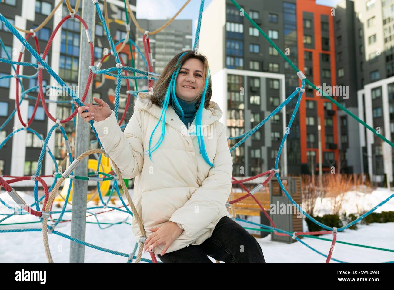 Woman sitting on pole hi-res stock photography and images - Alamy