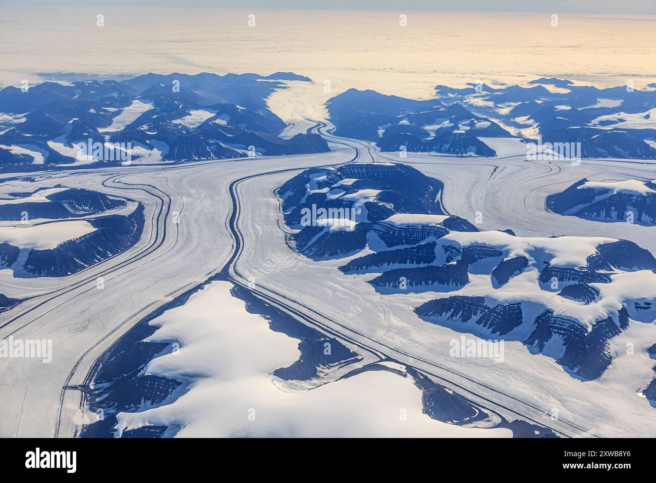 Aerial view of glacier tongues and glaciers at the coast with ...
