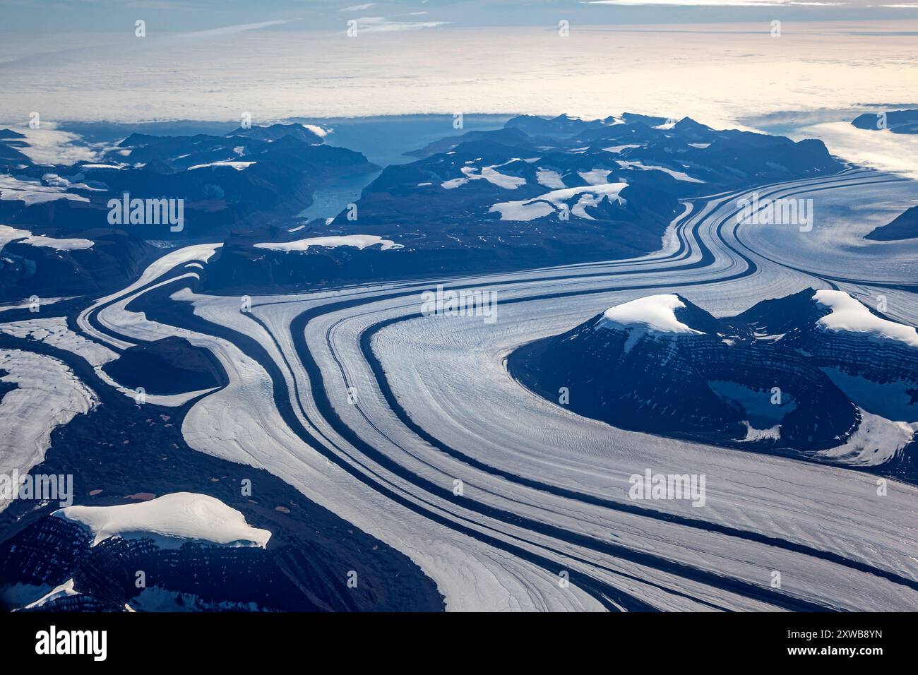 Aerial view of glacier tongues and glaciers at the coast with ...