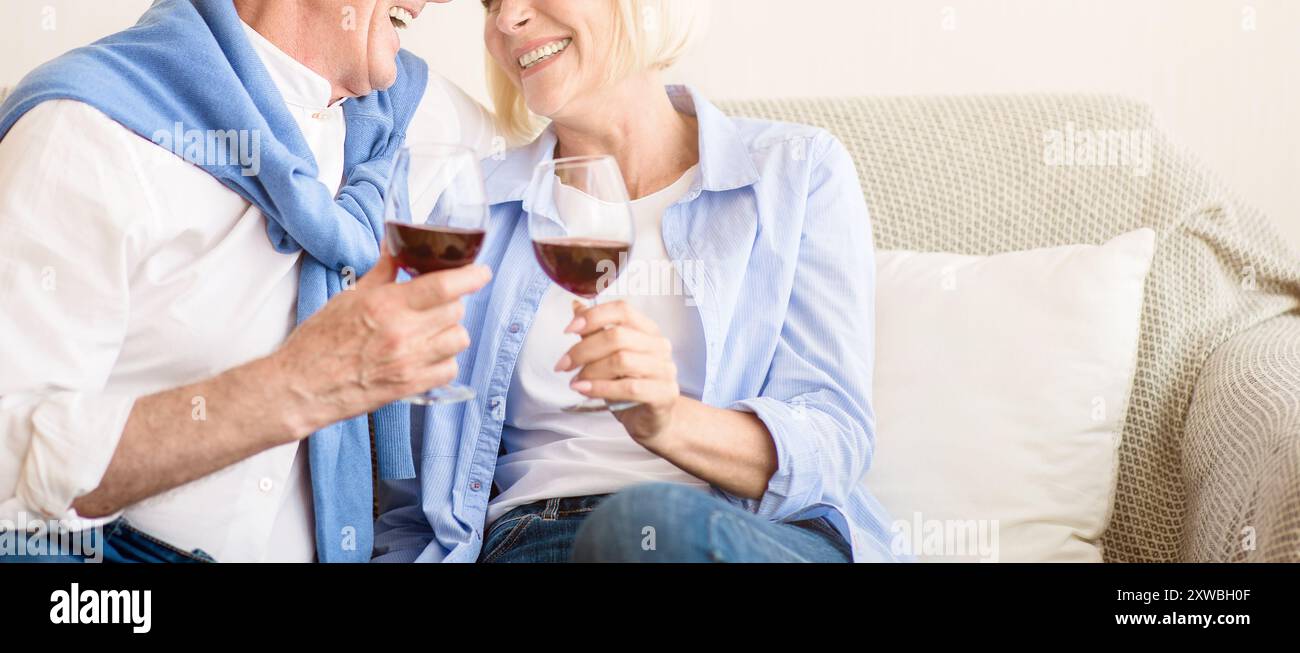 Happy retirement. Loving senior couple relaxing with wine Stock Photo ...