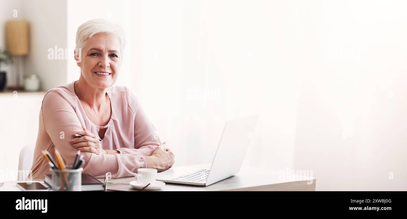 Successful happy aged lady working from home Stock Photo - Alamy